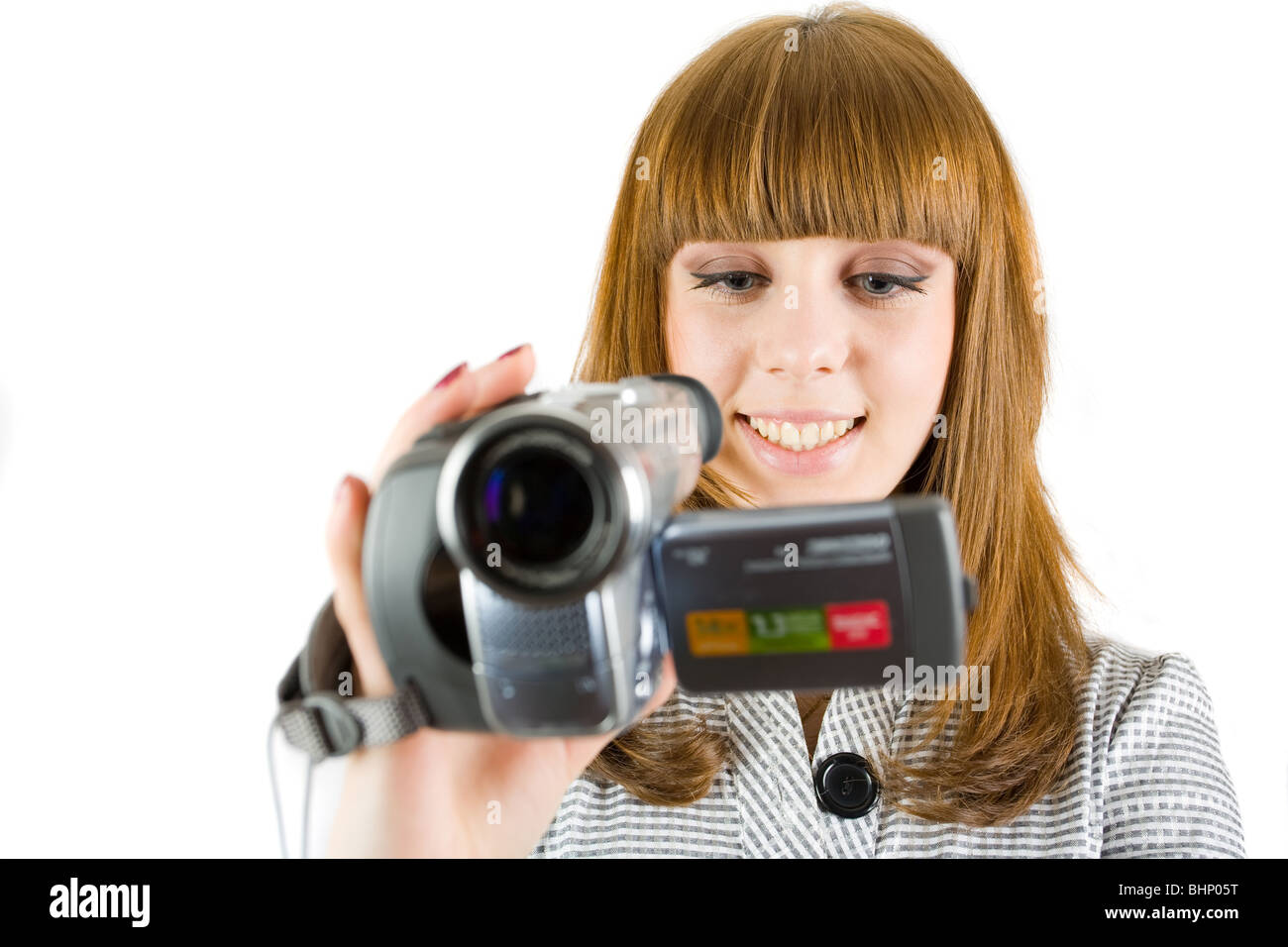 Girl using video camera (camcorder), isolated on white background Stock ...