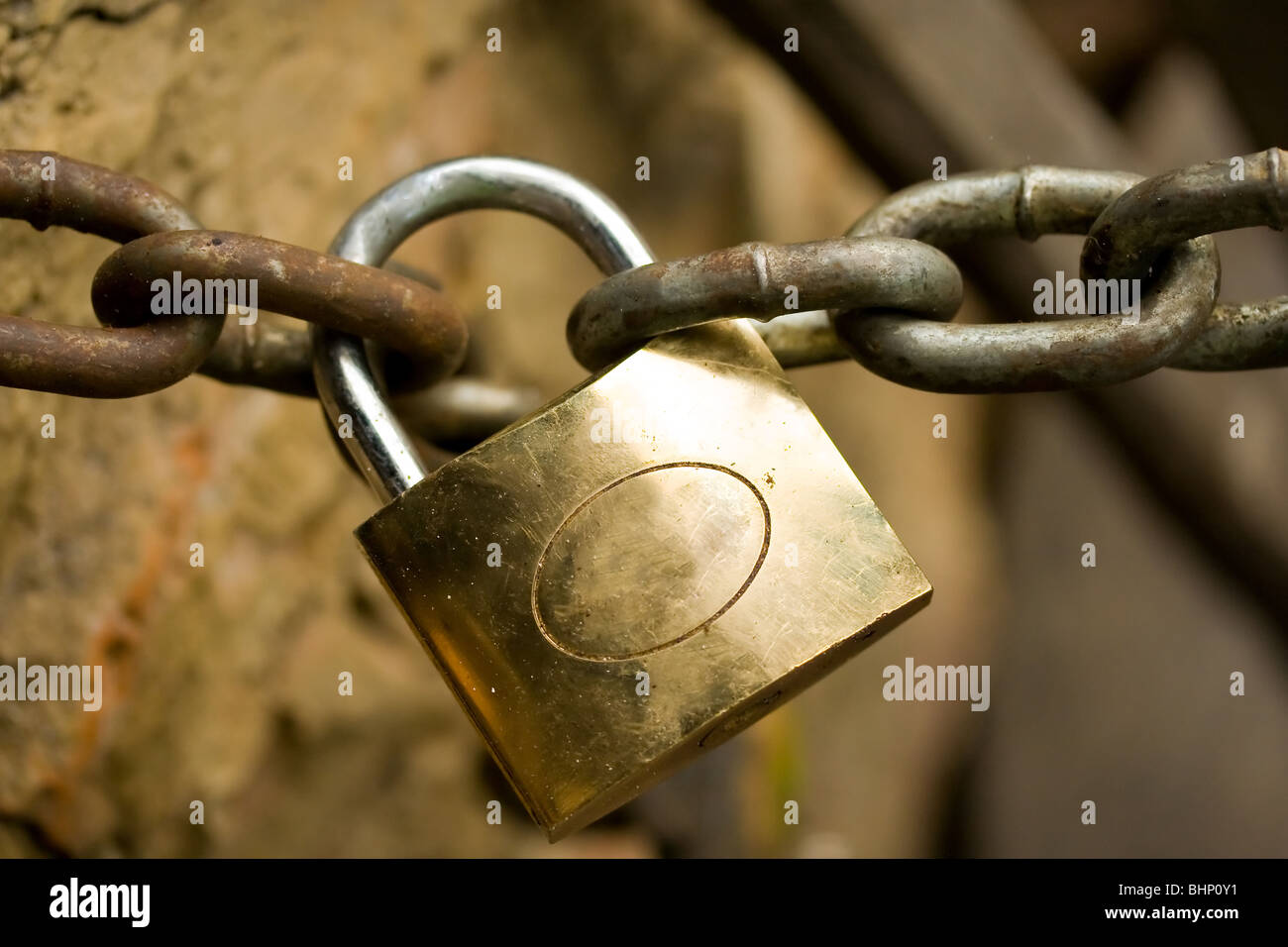 Rusty padlock tied on a big chain Stock Photo - Alamy