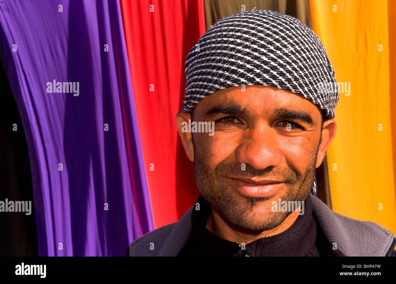 Arab man portrait with fabrics in oasis Town of Chebika near Mides and ...