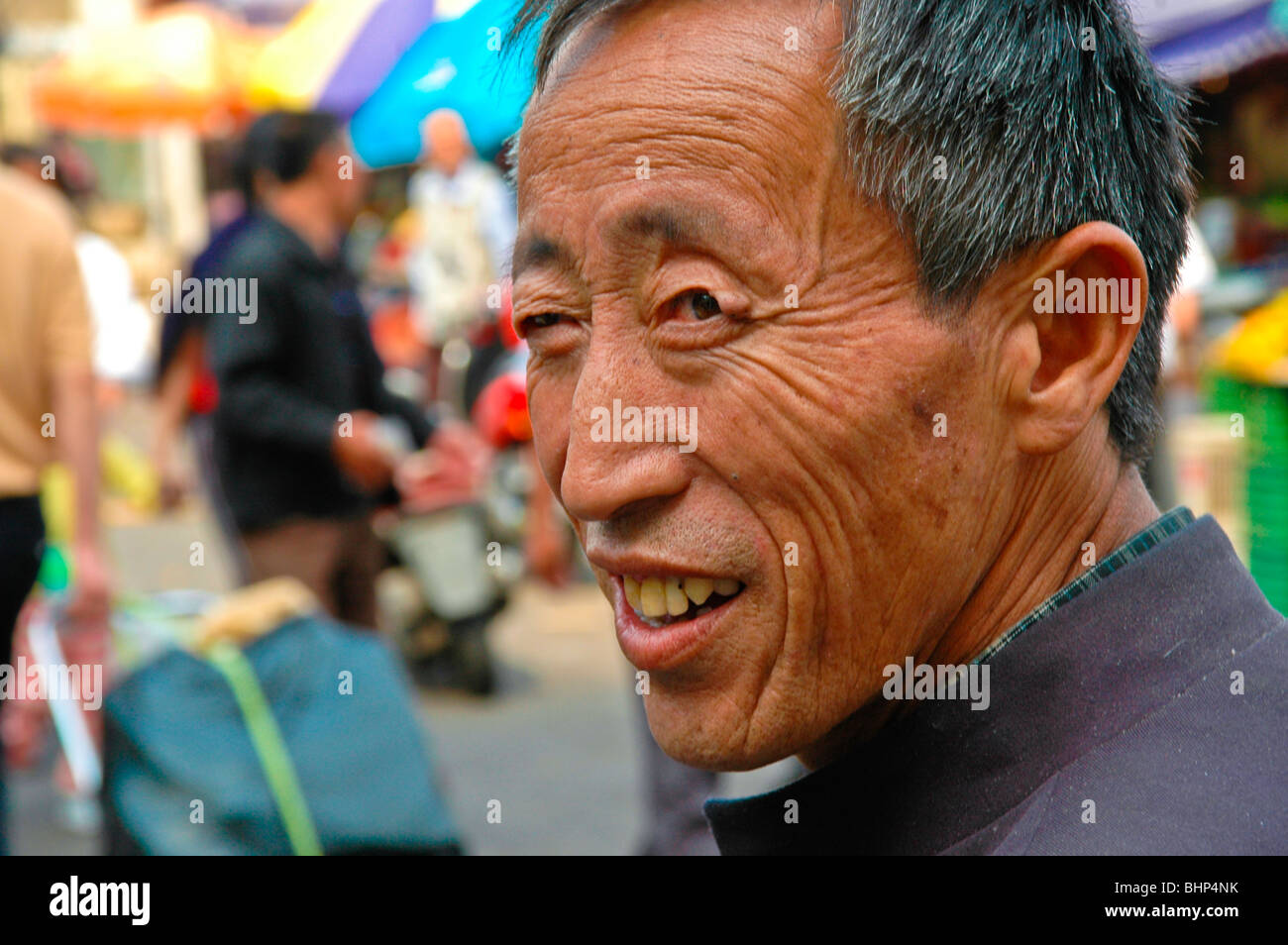 Portrait of a middle age chinese man in the streets of Shanghai, China ...
