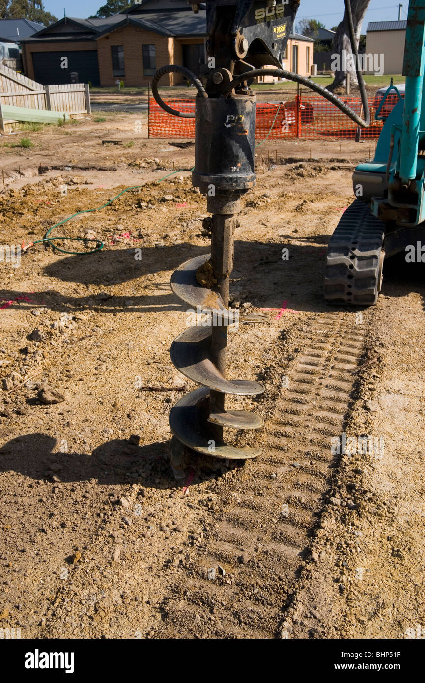 drilling foundation holes for a house slab Stock Photo - Alamy