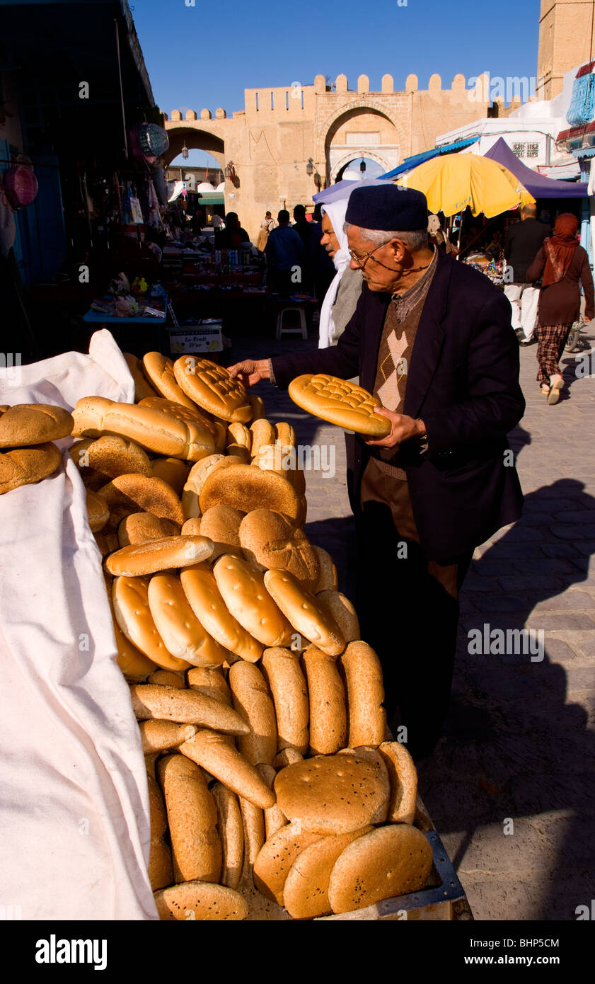 Famous Medina bazaar shops buying bread in Muslim Holy City of Kairovan ...
