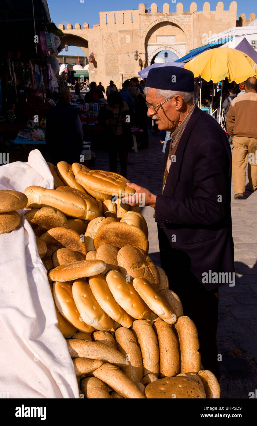 Famous Medina bazaar shops buying bread in Muslim Holy City of Kairovan ...