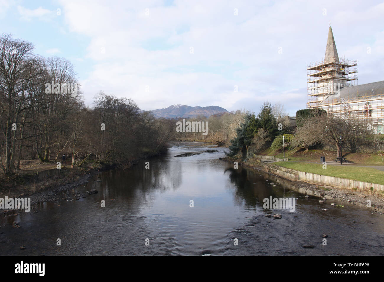 The white church with scaffolding beside the River Earn Comrie ...