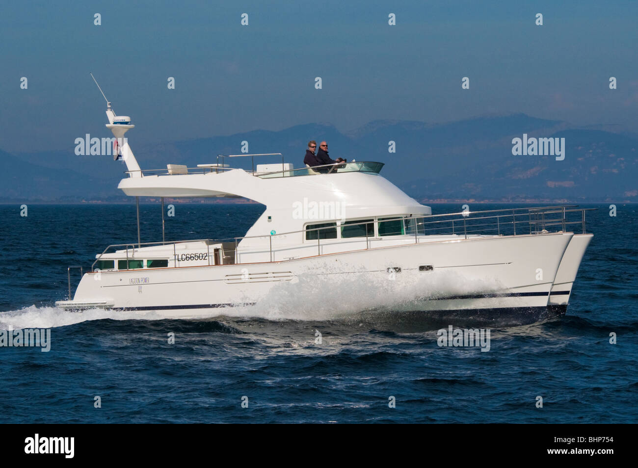 Side view of Lagoon 44 Power catamaran, yacht, Mediterranean Sea, coast ...