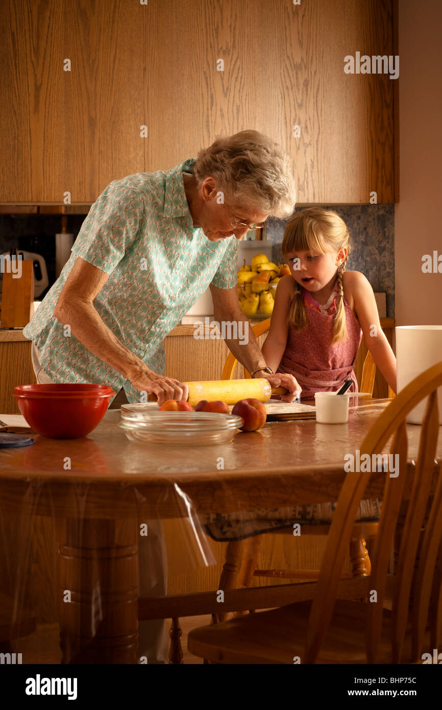 Five Year Old Girl And Her Great-Grandmother Roll Out Pastry; Redvers ...