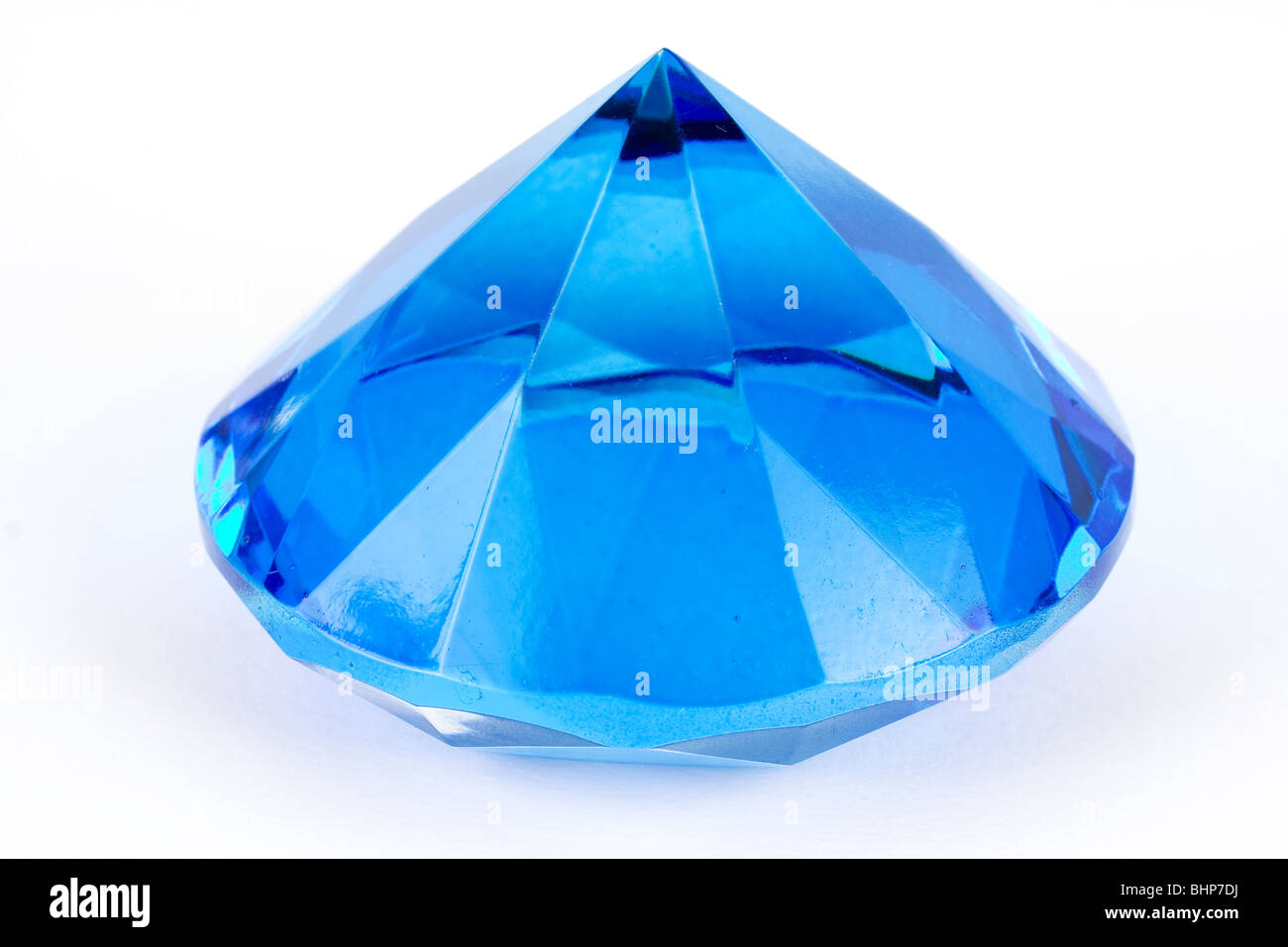 Blue glass polyhedron toy isolated on white background Stock Photo - Alamy