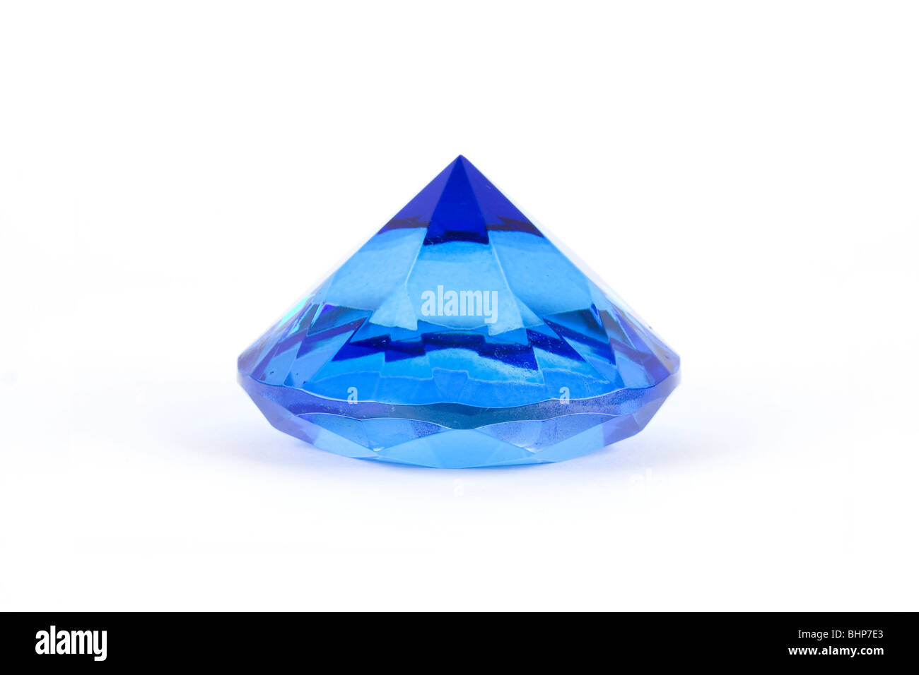 Blue glass polyhedron toy isolated on white background Stock Photo - Alamy