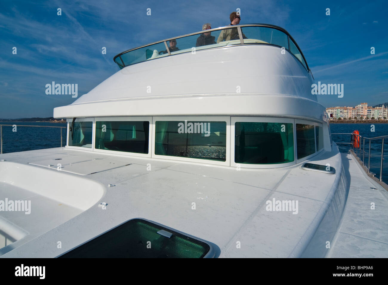 Deck and saloon with flybridge of a Lagoon 44 Power catamaran, yacht ...