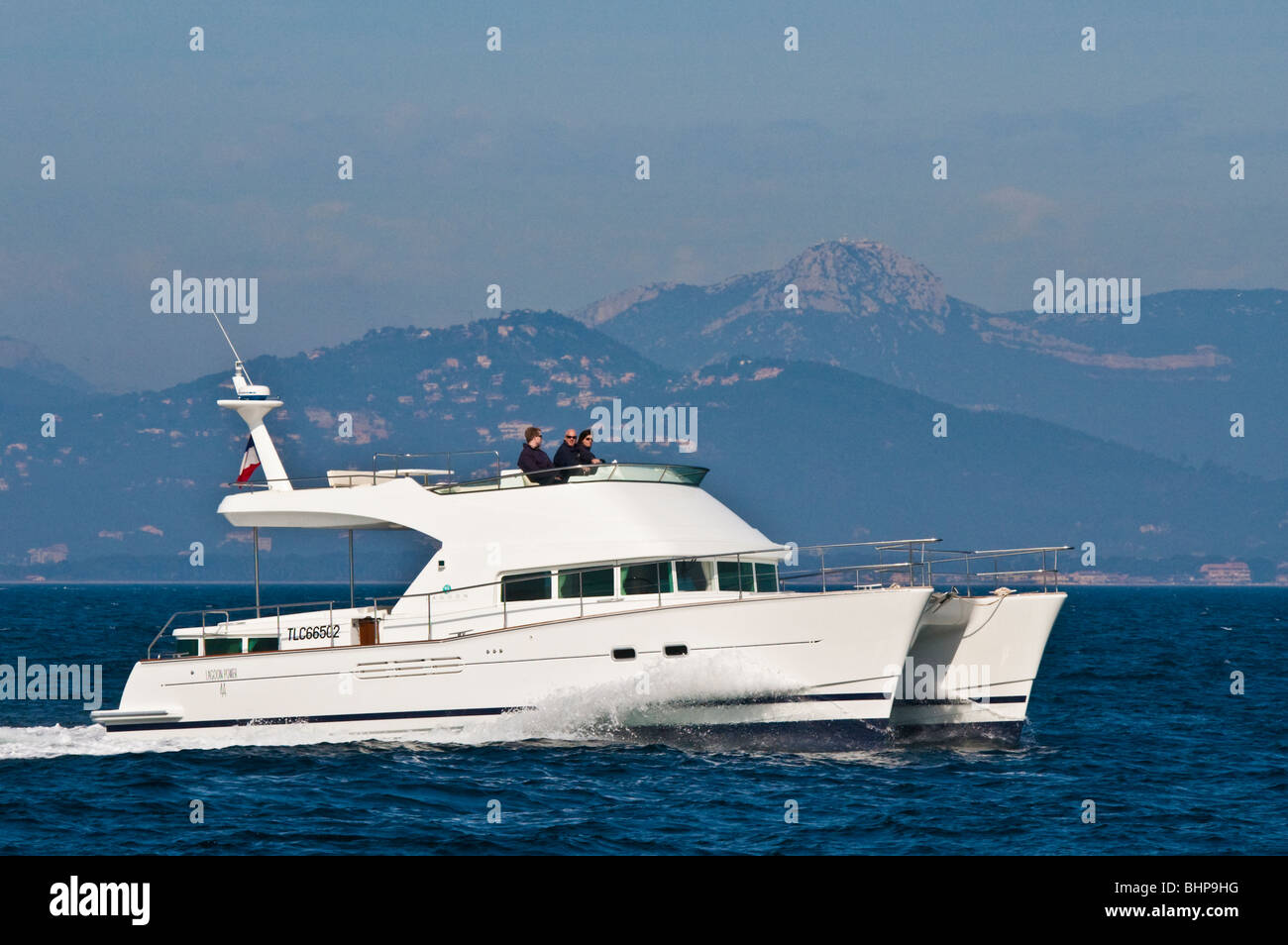 Side view of Lagoon 44 Power catamaran, yacht, Mediterranean Sea, coast ...
