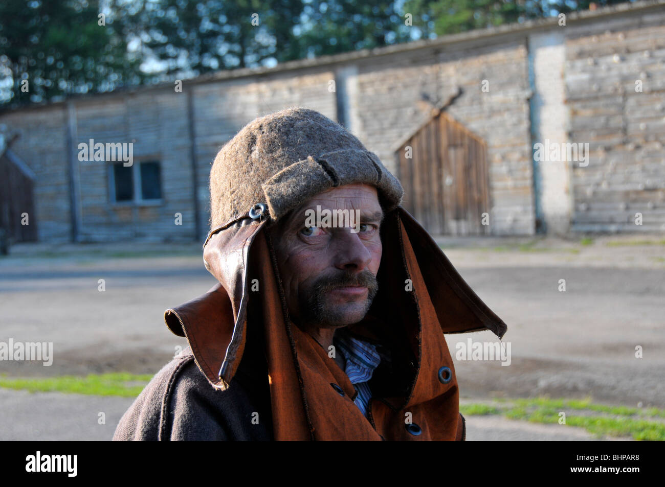 A man in medieval dress on a former collective farm in Lithuania Stock ...