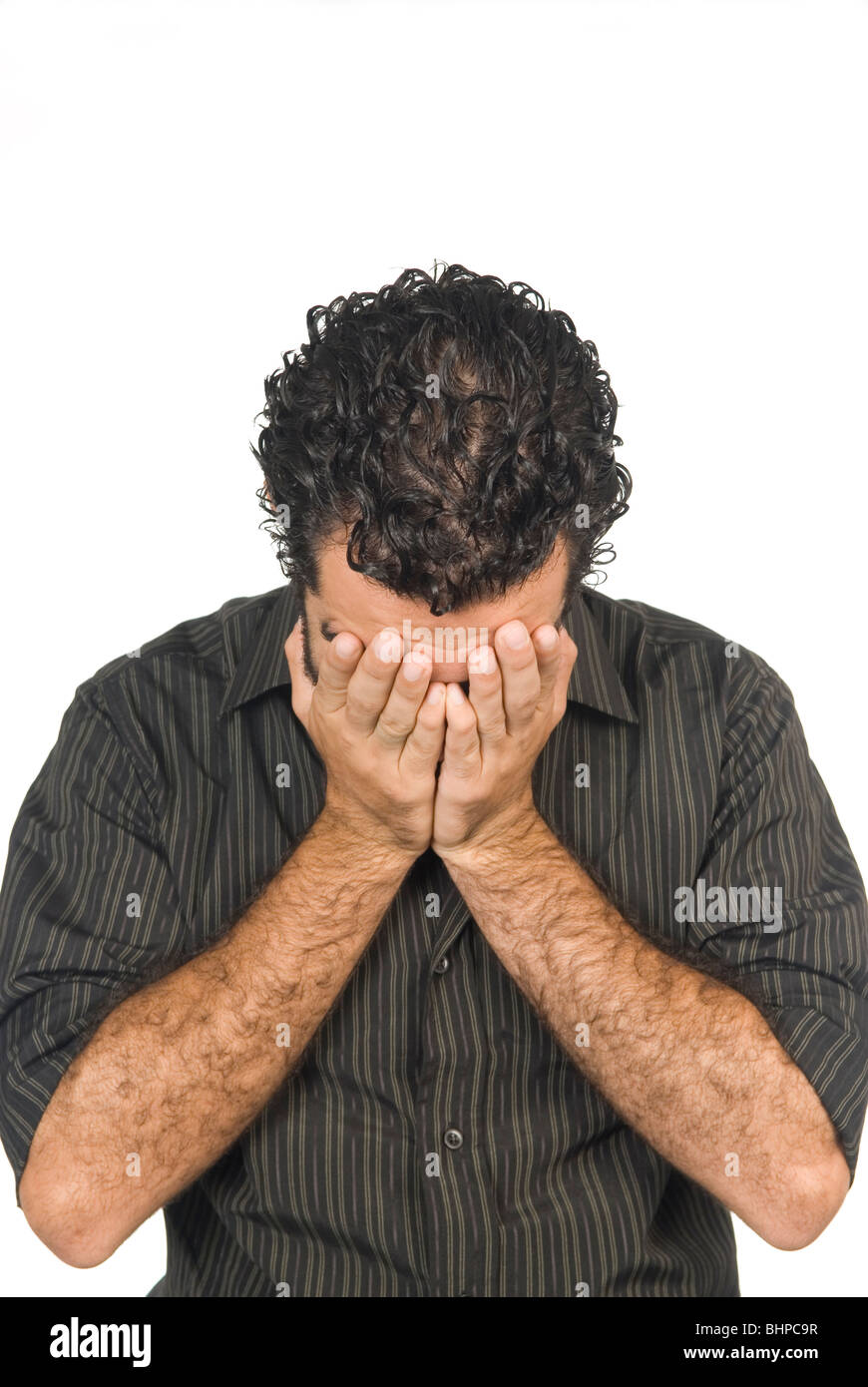 25 years old Middle Eastern man crying with head in hands Stock Photo ...