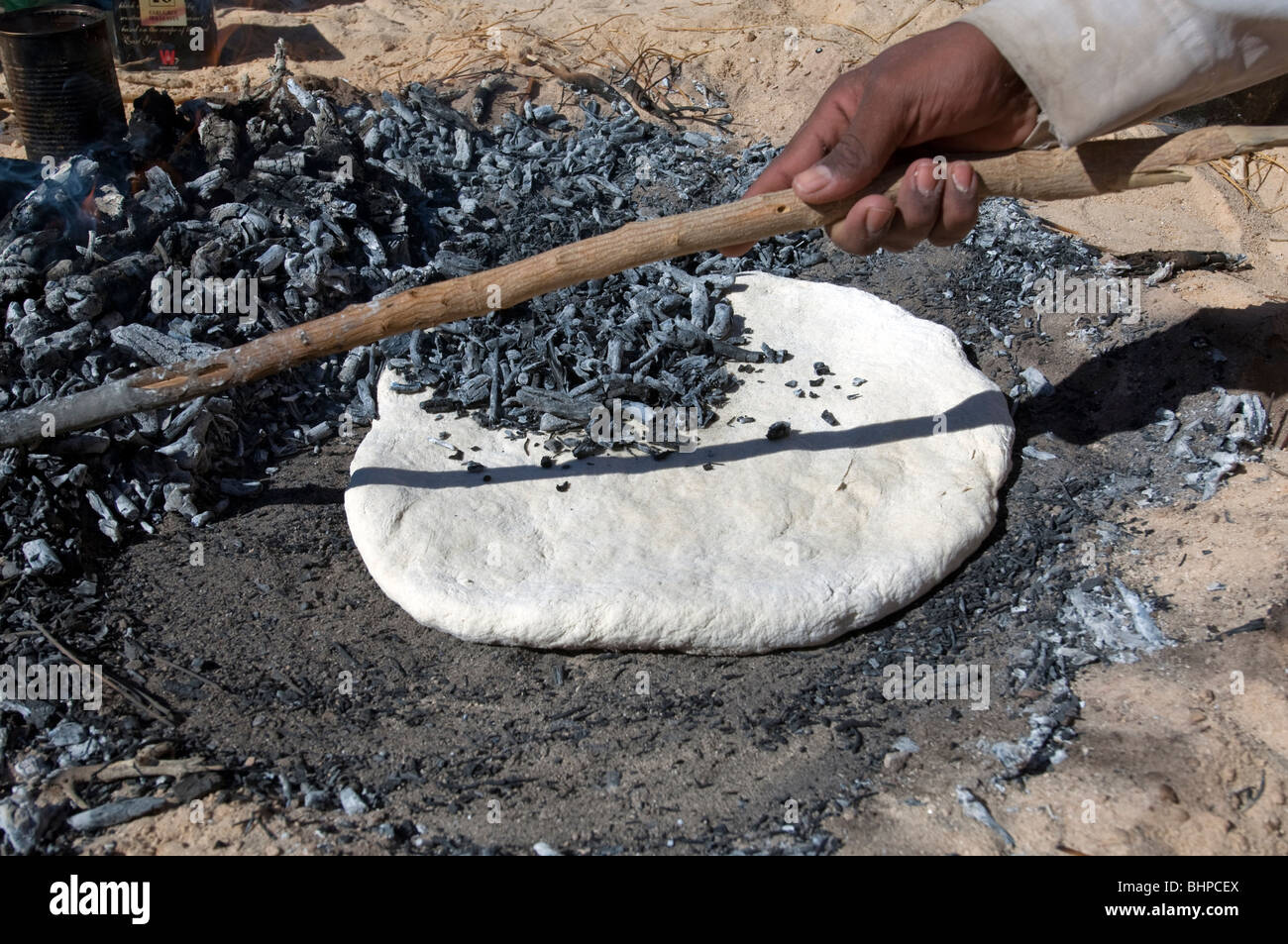 Bedouin men prepare the Libeh, a Bedouin version of simple unleavened ...