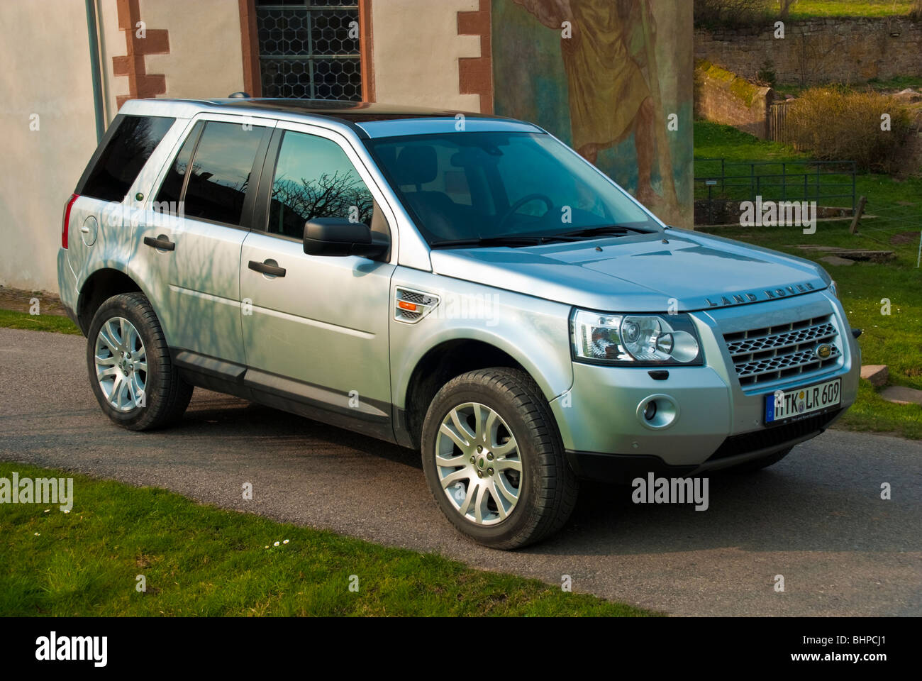 Land Rover Freelander, 2007 model, parked in a driveway in front of a ...