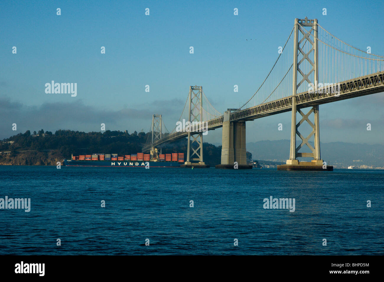 San Francisco Oakland Bay Bridge and container ship, California USA ...