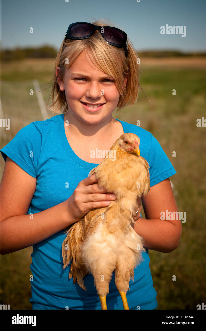 Twelve Year Old Girl Holding Heritage Breed Of Free Range Chicken ...
