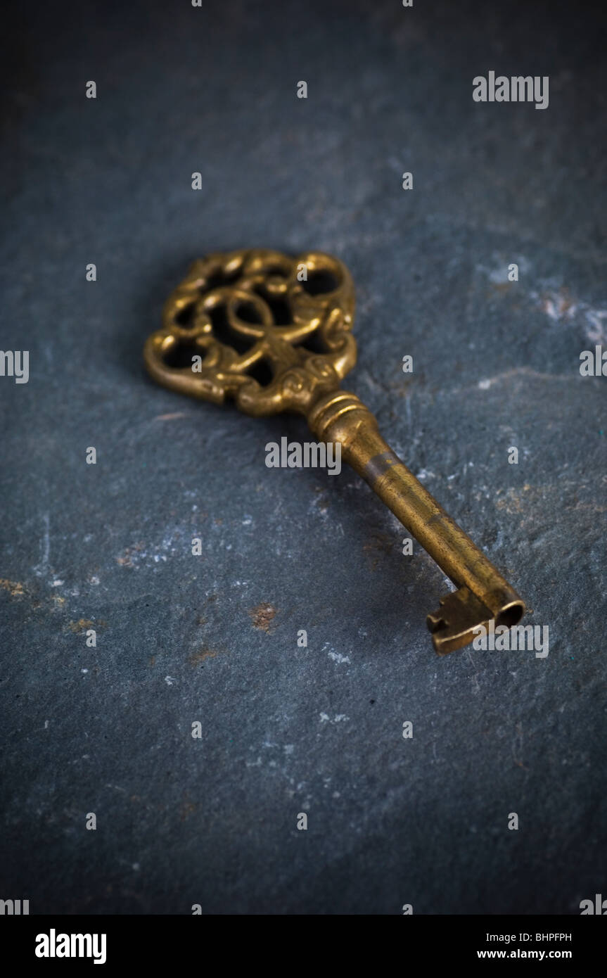 Brass ornate key Stock Photo - Alamy