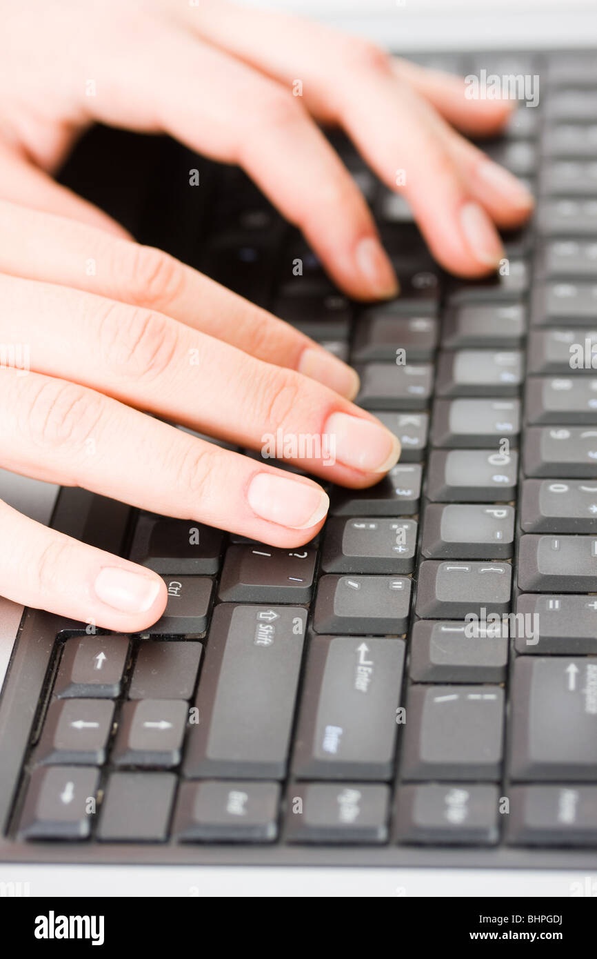 Fingers on a black keyboard Stock Photo - Alamy