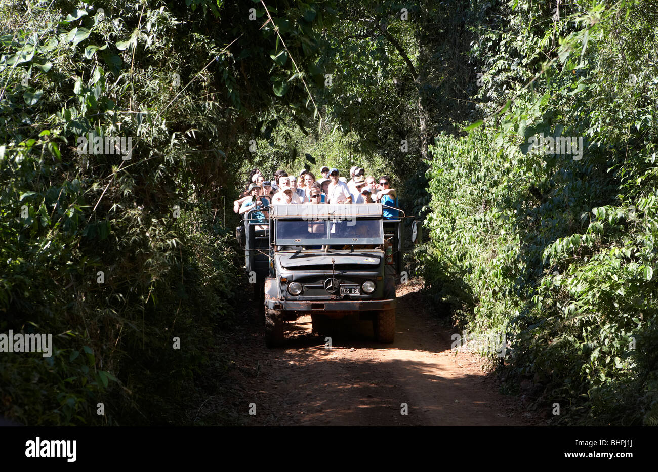 tourists and tour guide on the 4x4 great adventure ride along the ...