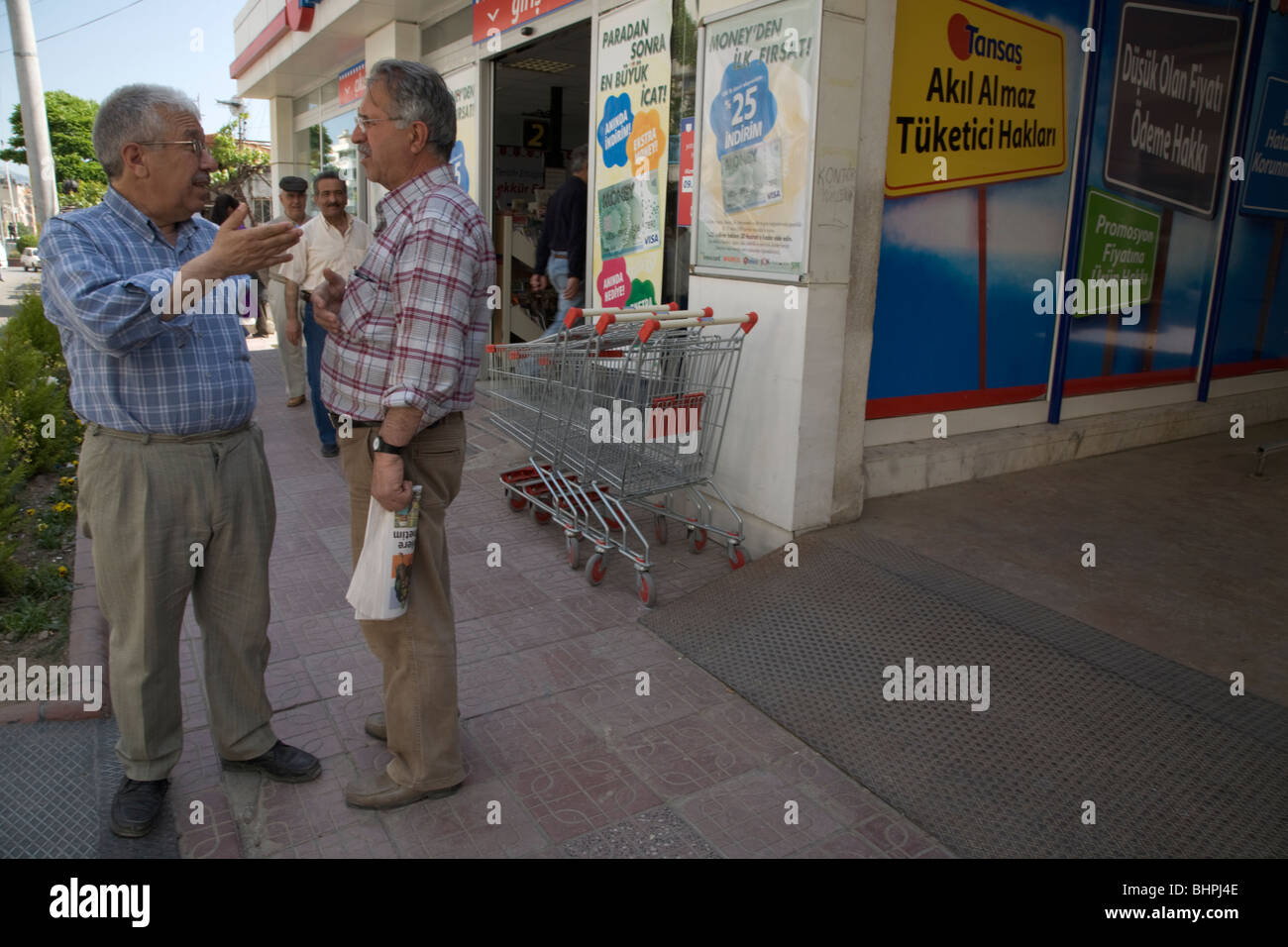 Turkish Men Talking In Street Outside Supermarket Turkey Stock Photo ...