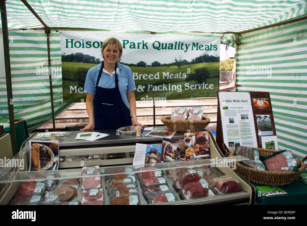 Meat stall holder, Kingsbridge Farmers Market, Devon, UK Stock Photo ...