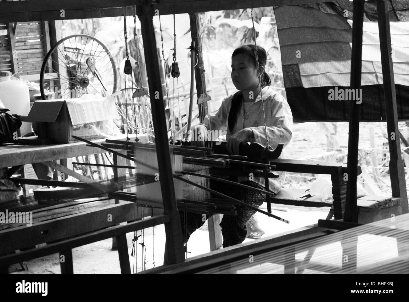 young girl weaving , fishing community , mekong river , phnom penh ...