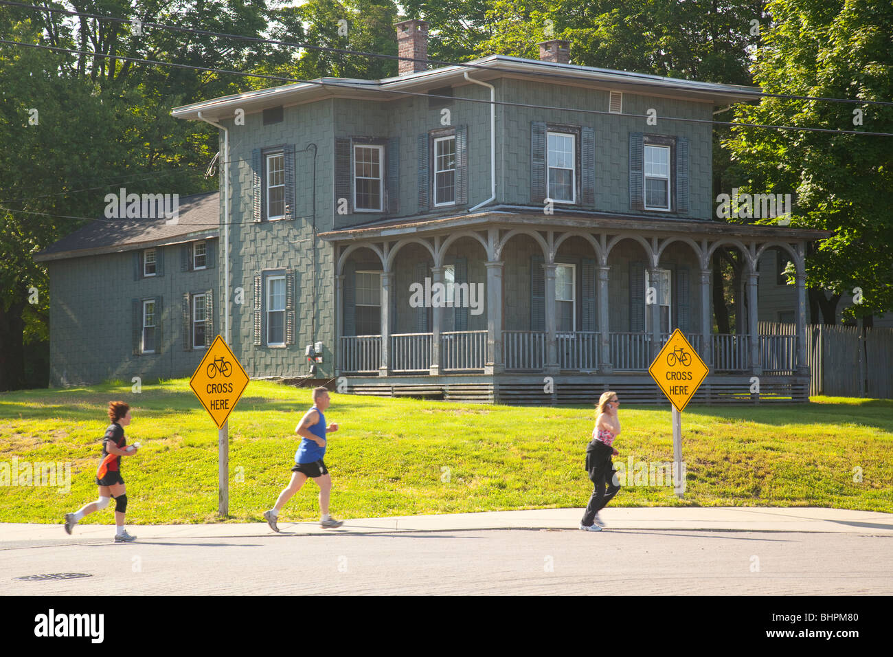 people running in bike lane Stock Photo - Alamy