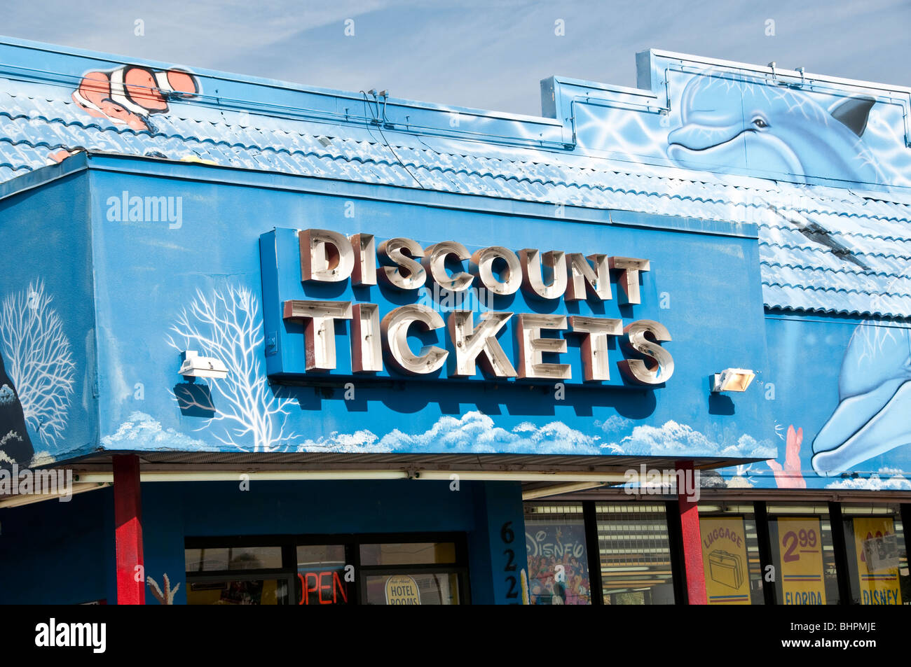 Discount ticket sign blue background daylight Stock Photo - Alamy
