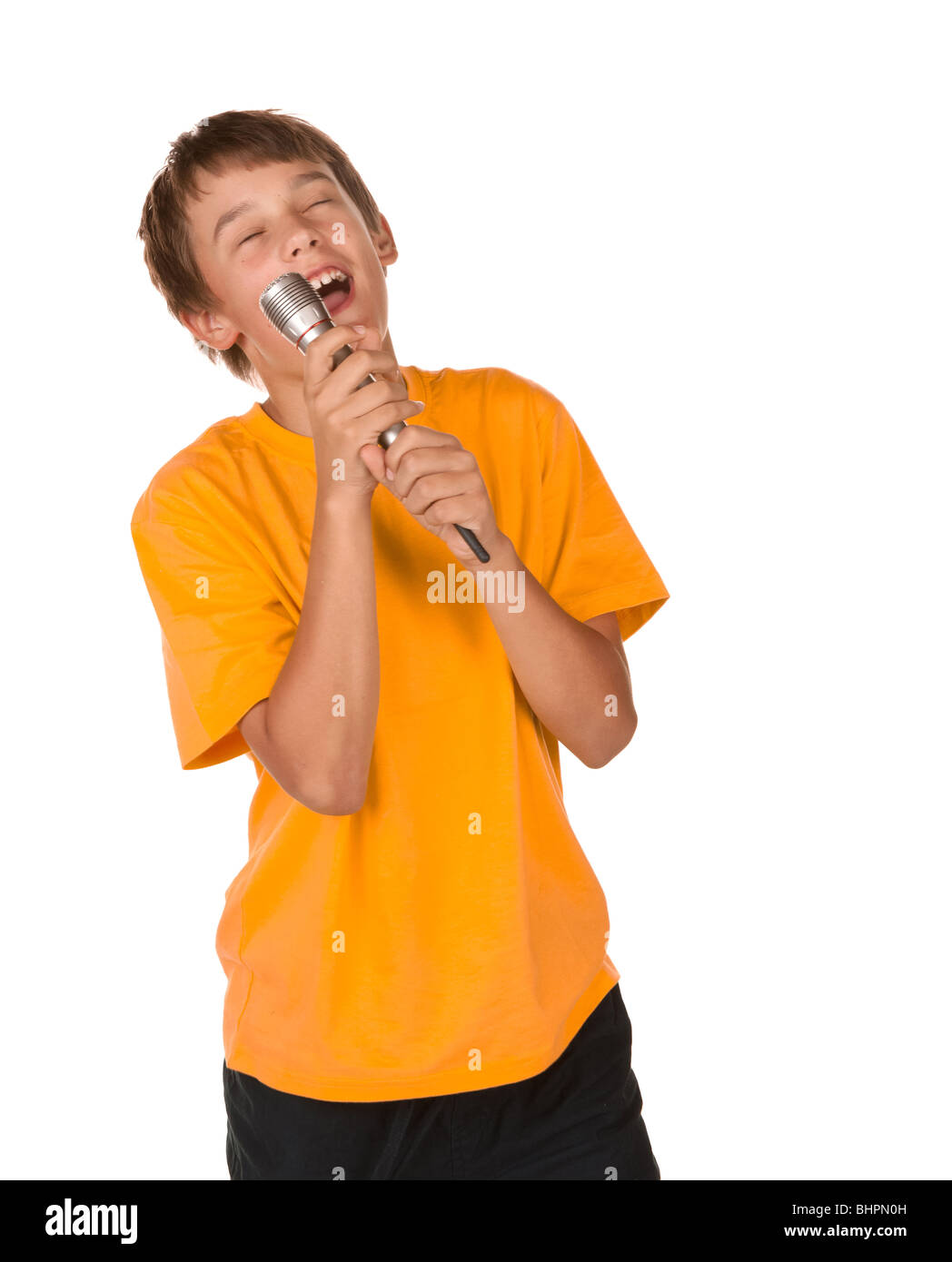 boy singing karaoke isolated on white background Stock Photo - Alamy
