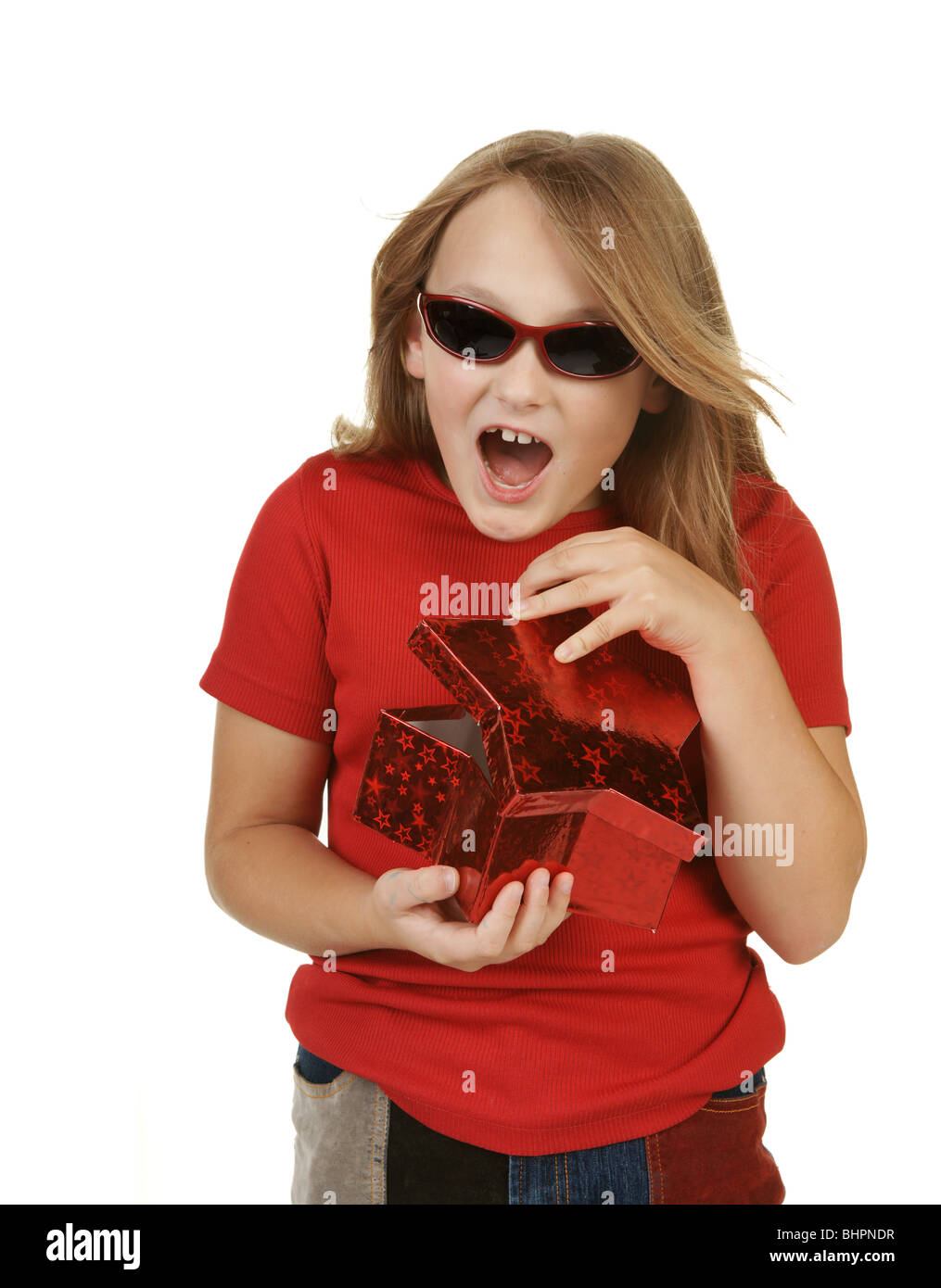 Child opening christmas present shock hi-res stock photography and ...