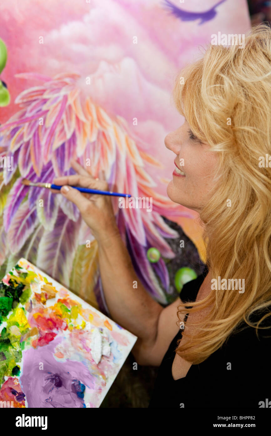 female artist painting with oil on canvas Stock Photo - Alamy