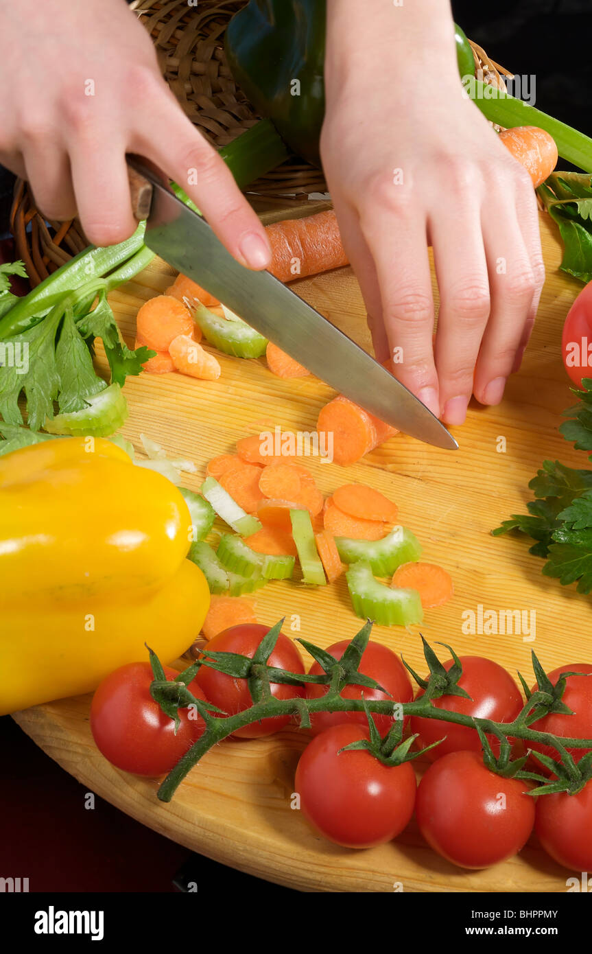 Human Hands cutting vegetables Stock Photo - Alamy