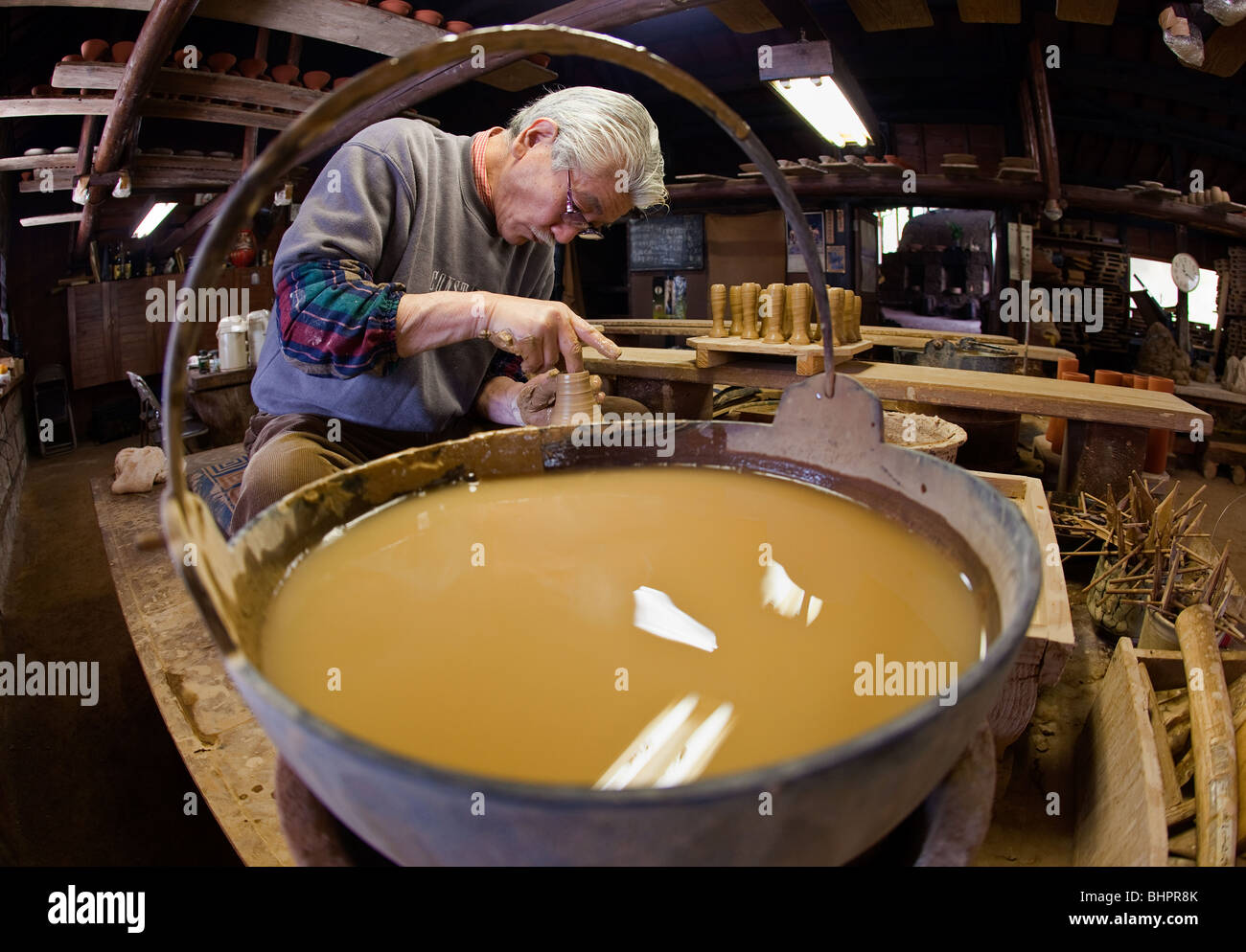 A Japanese potter shaping pottery Stock Photo - Alamy