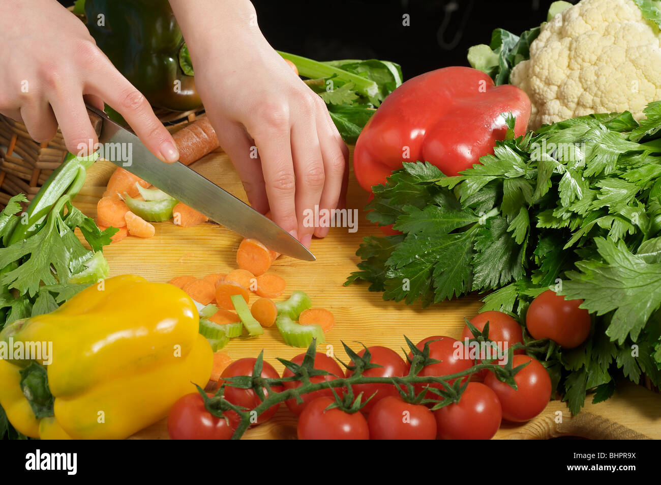Human Hands cutting vegetables Stock Photo - Alamy