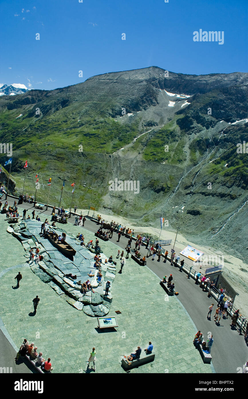 Landscape with groups of people in a park near a mountain Stock Photo ...