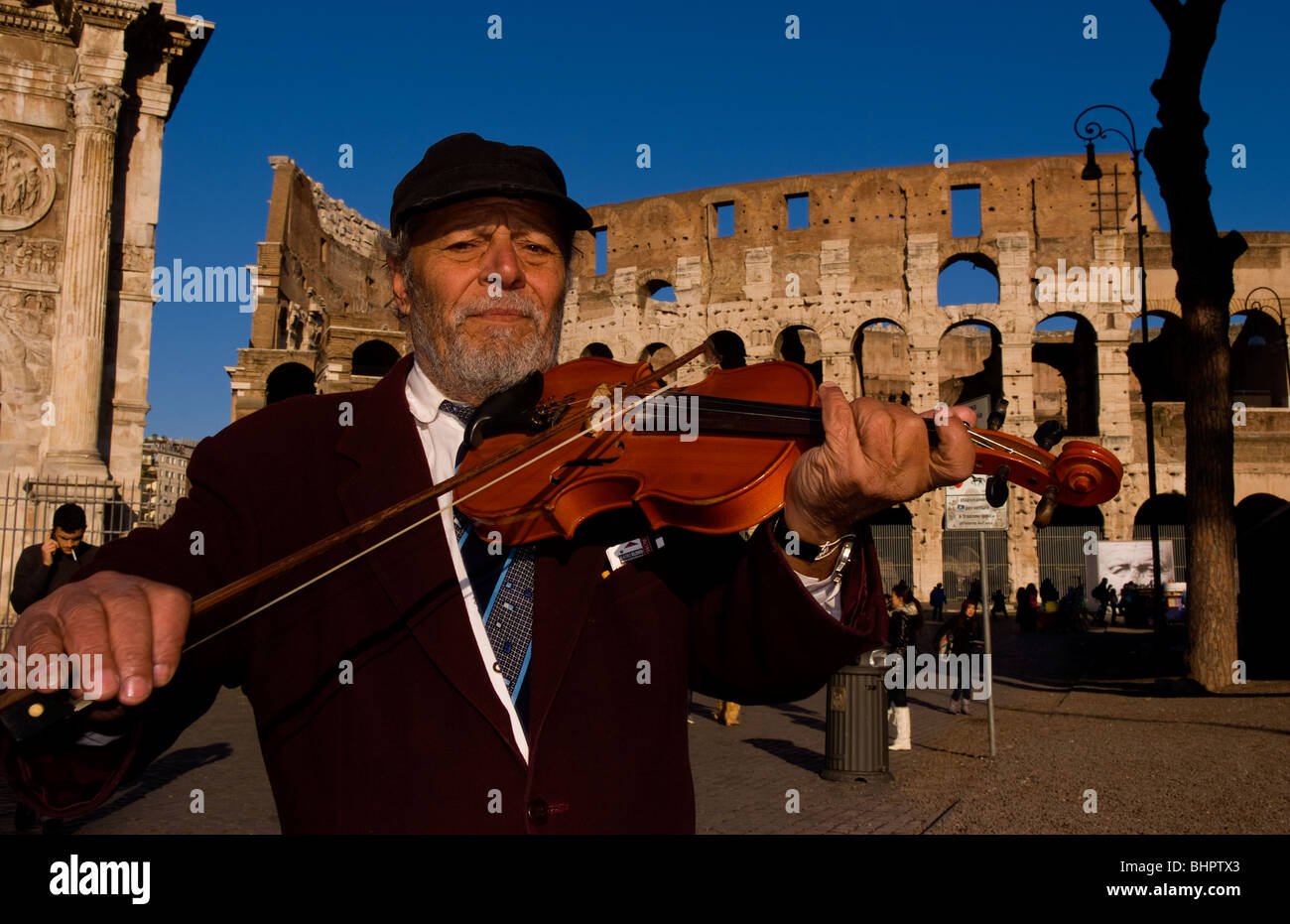 Local man playing violin at famous Colosseum in Rome Italy Landmark ...