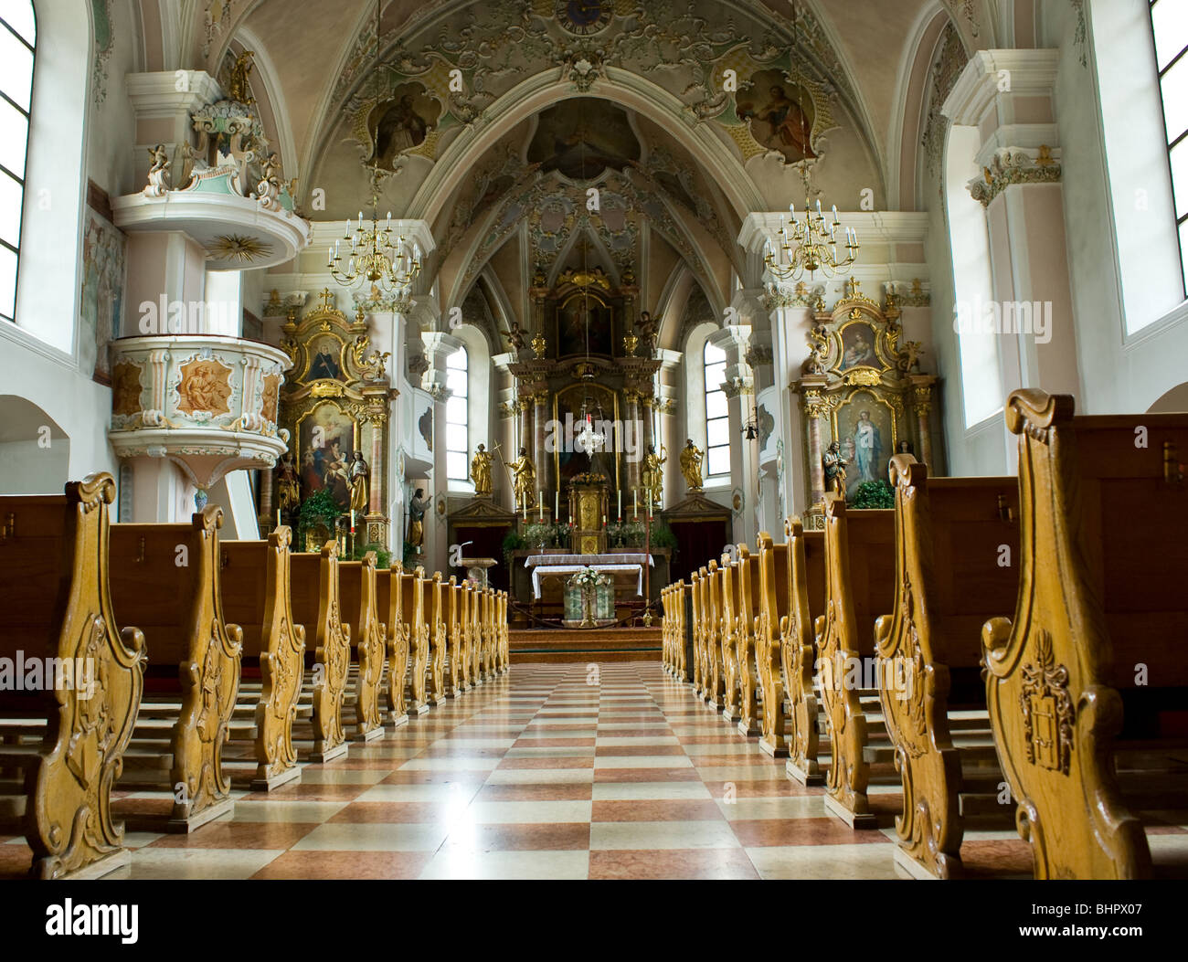 Inside of a church with rows of benches Stock Photo - Alamy
