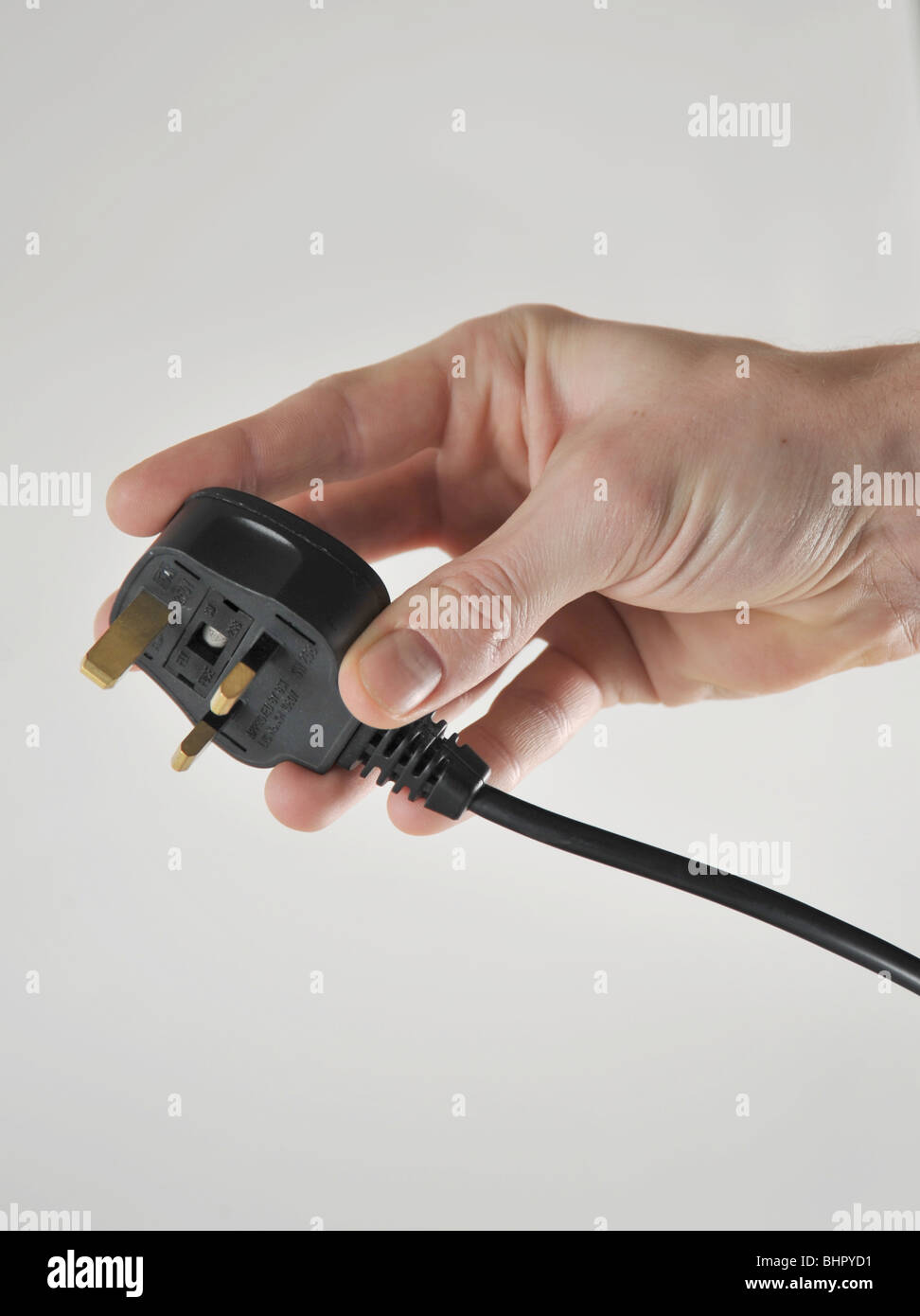 Hand put electric plug socket hi-res stock photography and images - Alamy