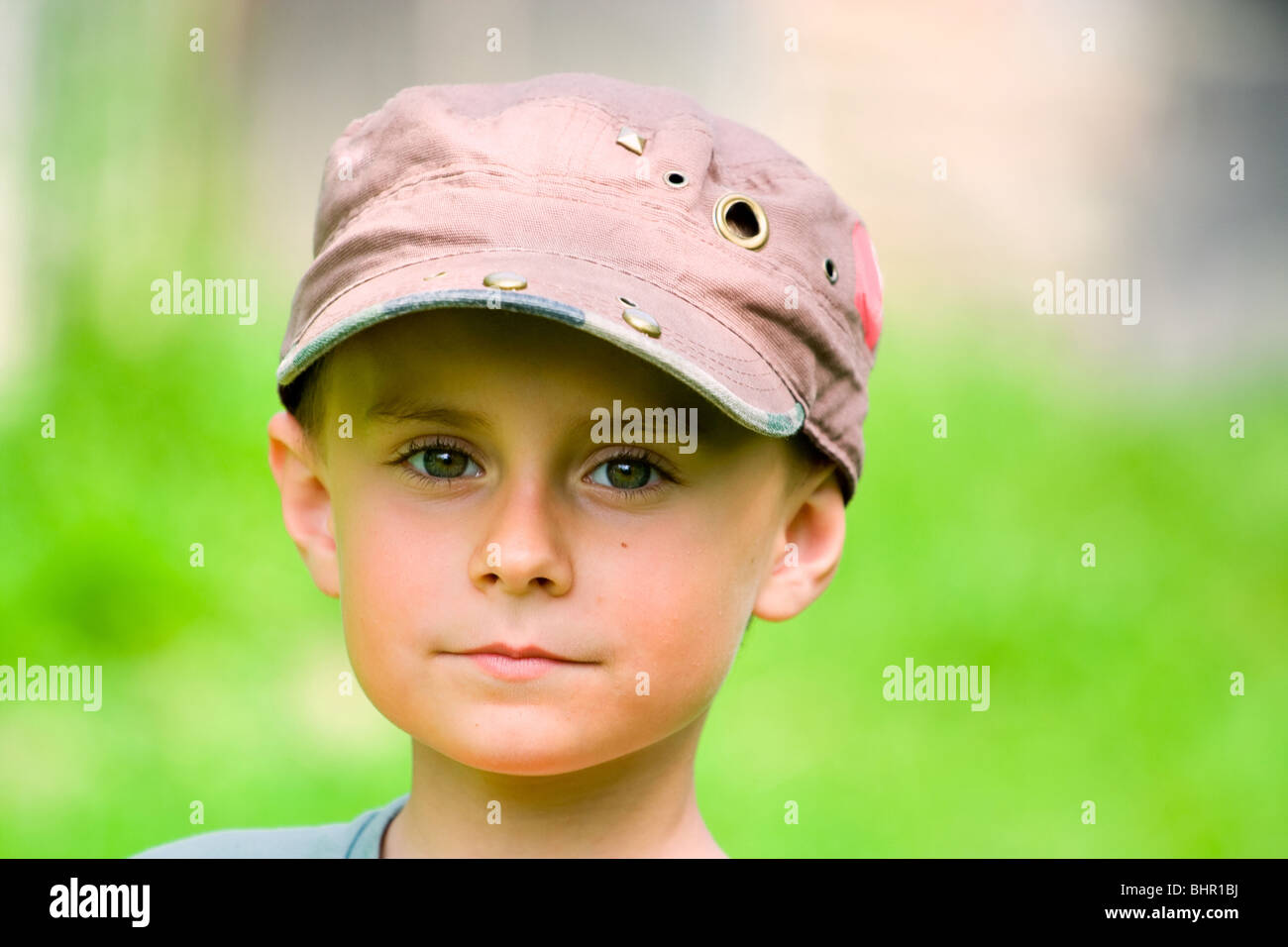 Portrait of a serious looking boy outdoors Stock Photo - Alamy