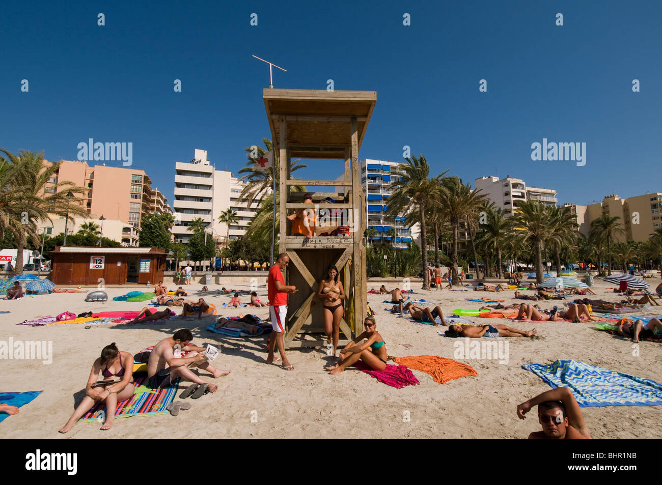 Young people relaxing on the beach of El Arenal Majorca with in the ...