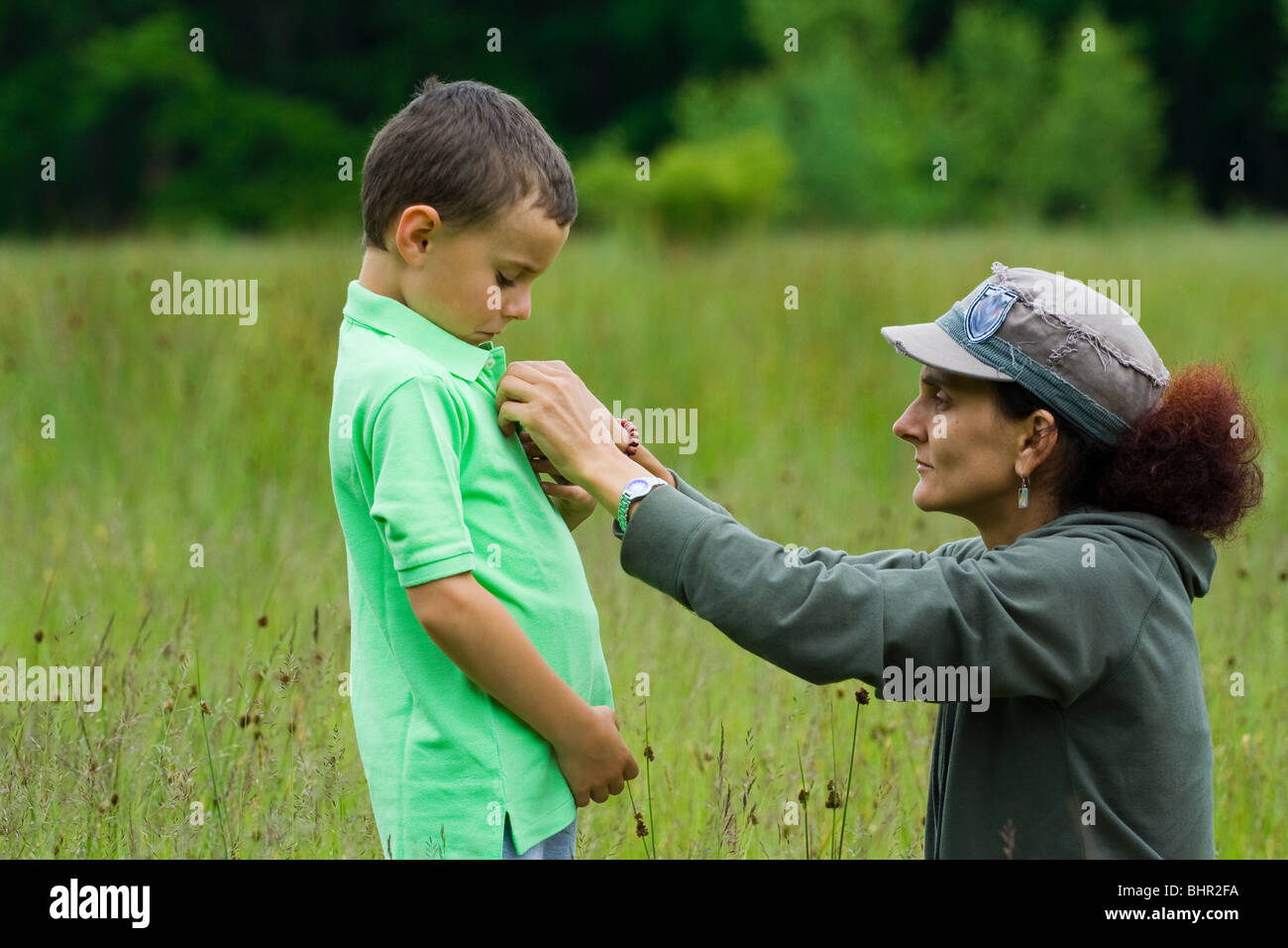 Mom helping child get dressed hi-res stock photography and images - Alamy