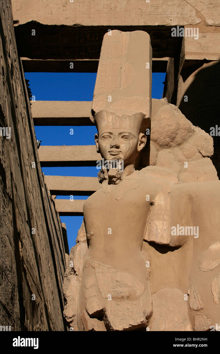 Statue of the deity Amun Ra in the Great Hypostyle Hall of Karnak ...