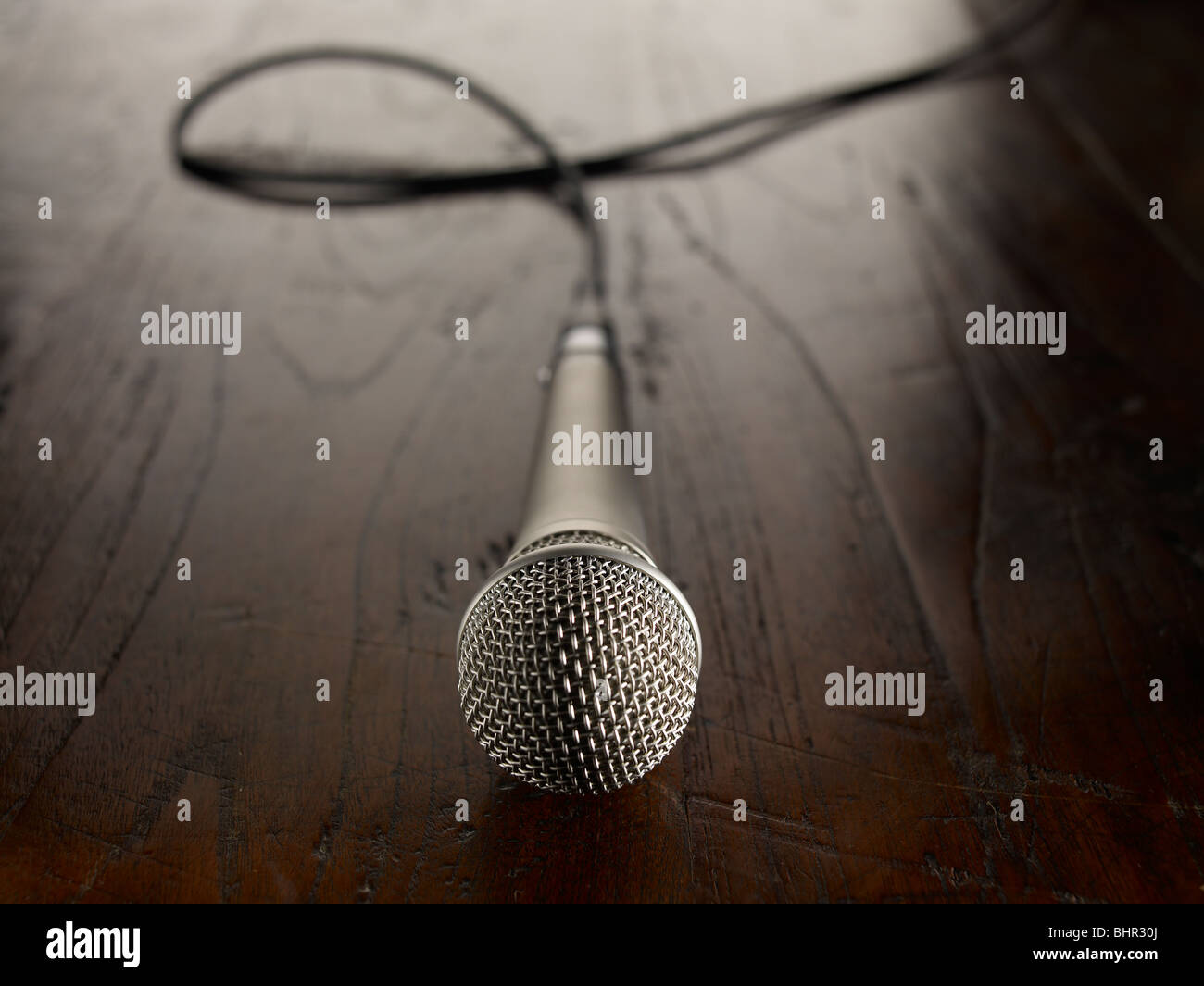 microphone on a stage floor table top Stock Photo - Alamy