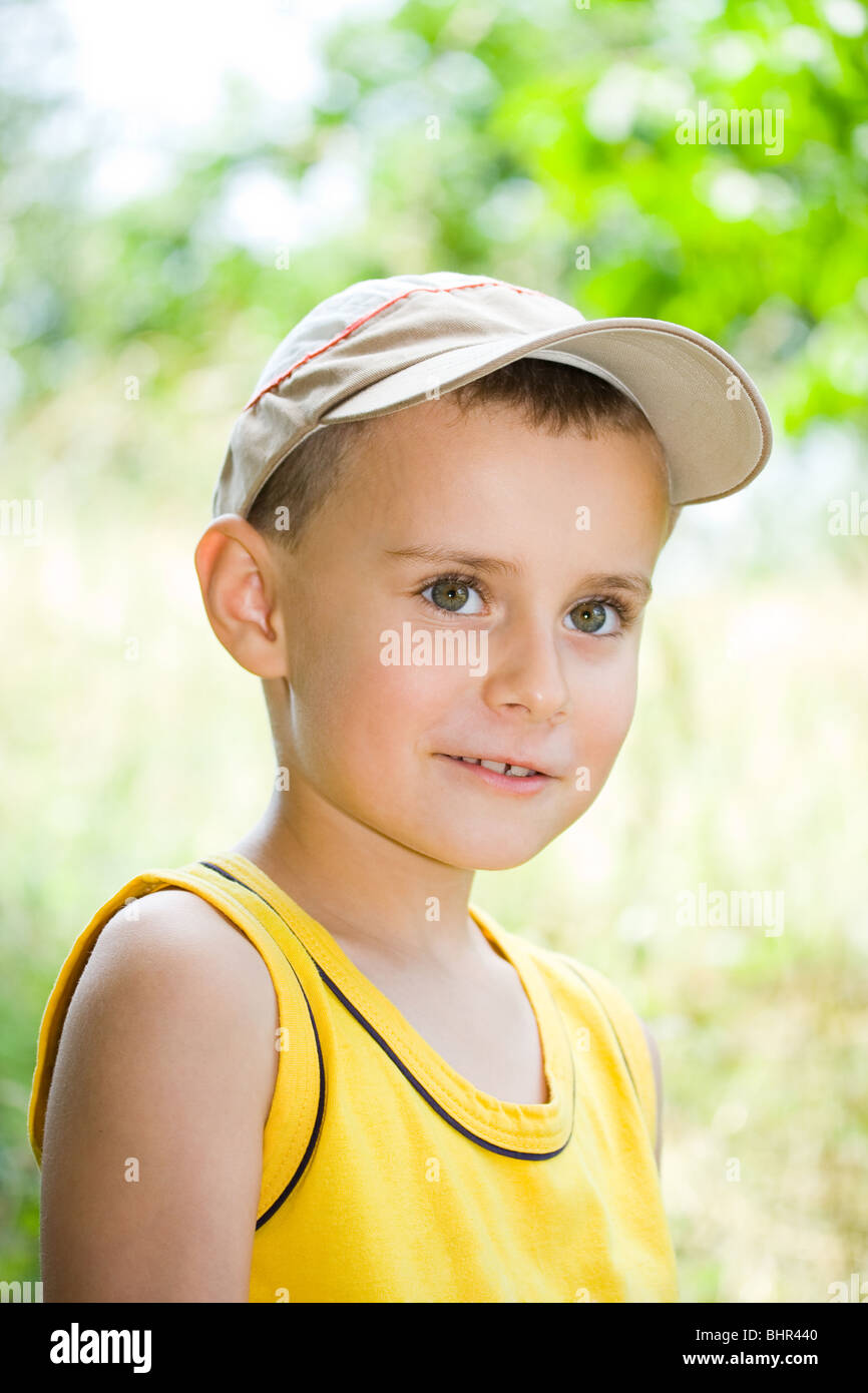 Portrait of a beautiful little boy with cap Stock Photo - Alamy