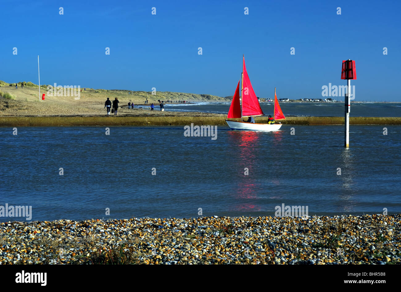 Dinghy with red sails hi-res stock photography and images - Alamy