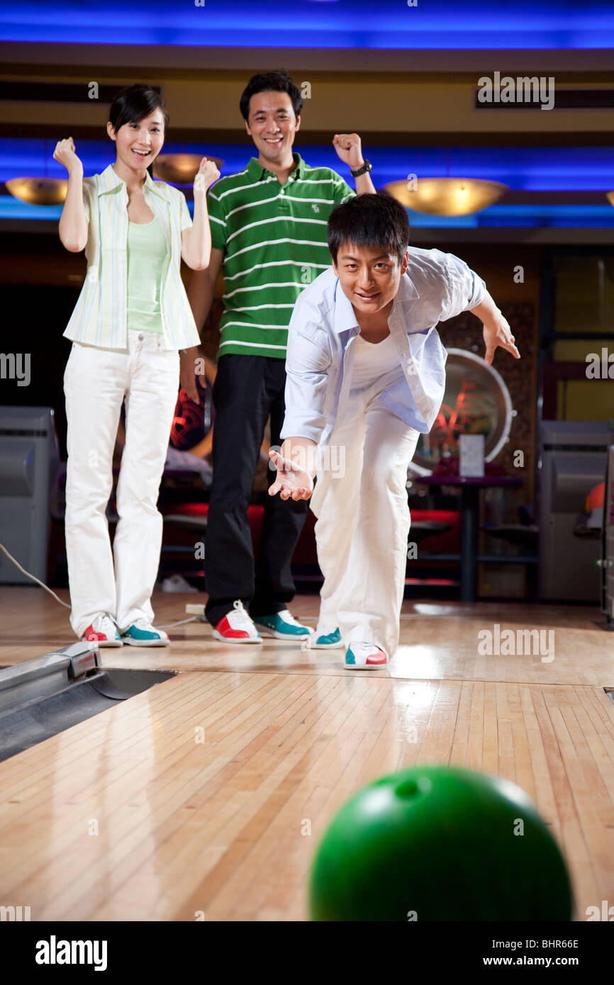 Three young women bowling hi-res stock photography and images - Alamy