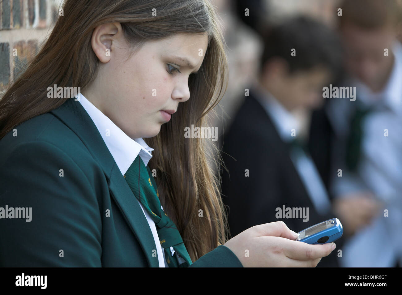 School mobile phones uniform hi-res stock photography and images - Alamy
