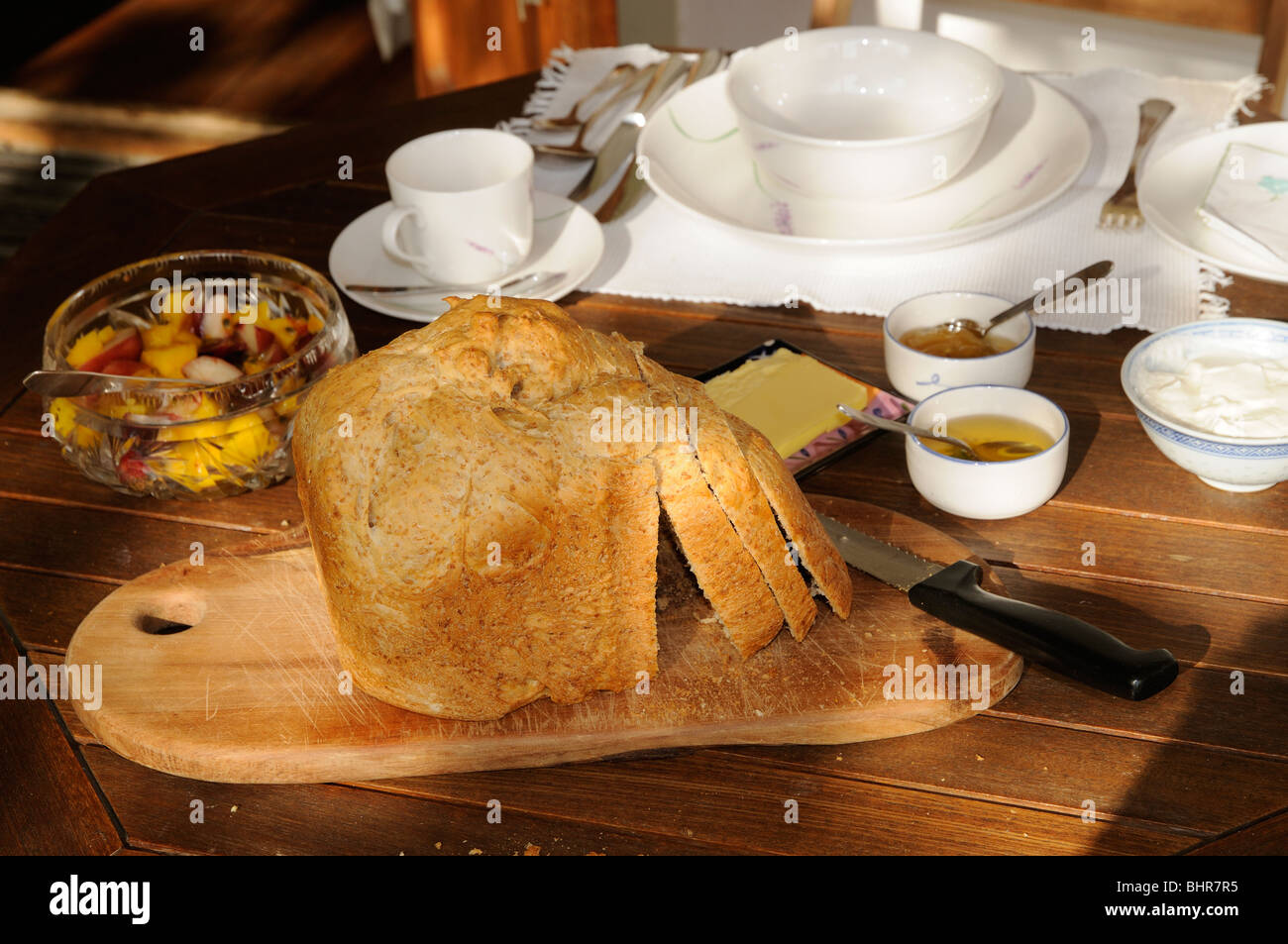 freshly baked loaf of bread on breakfast table Stock Photo - Alamy