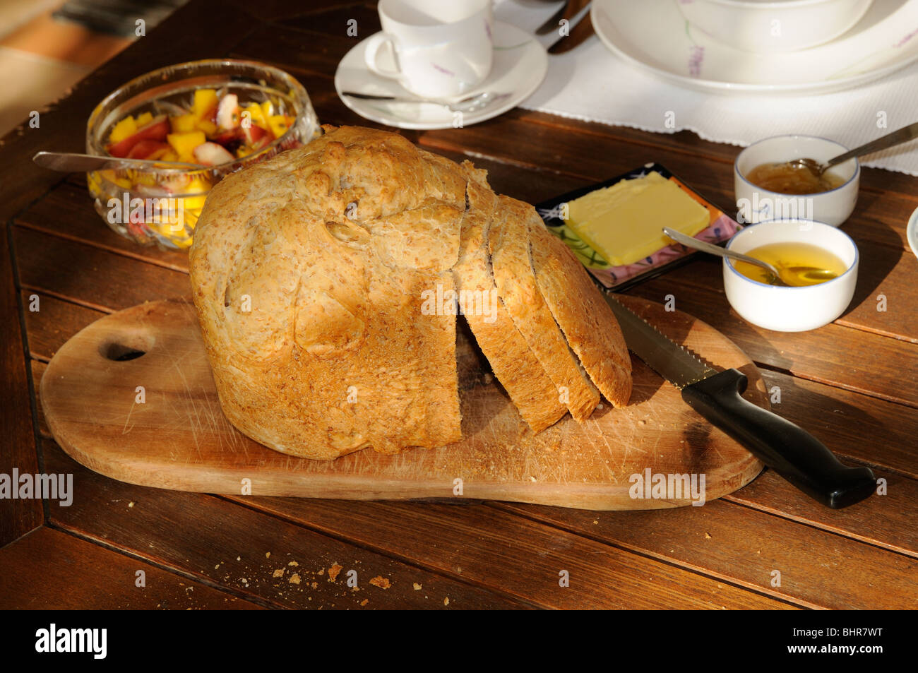 freshly baked loaf of bread on breakfast table Stock Photo - Alamy