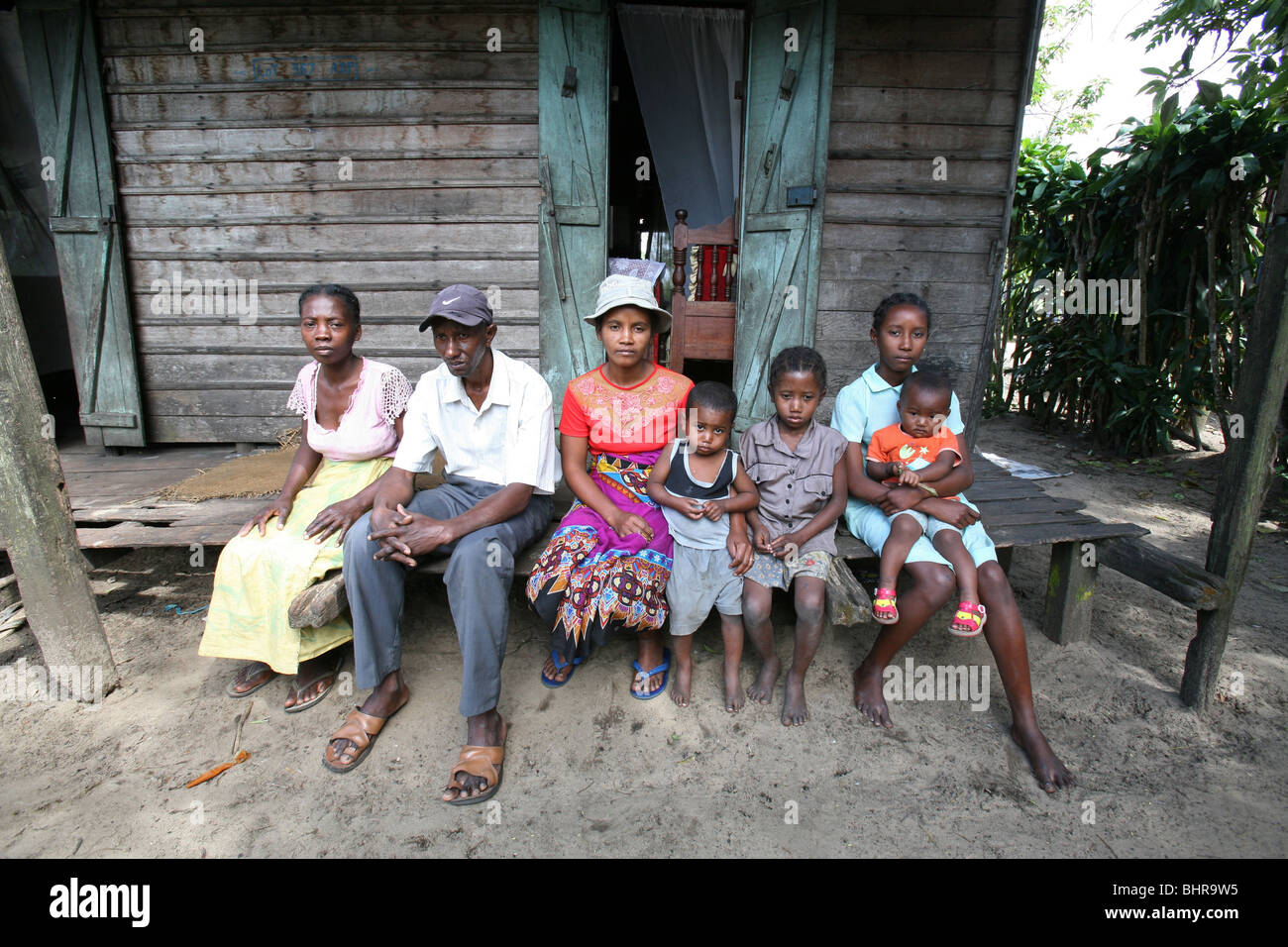 A family in Madagascar sit outside their family home, Indian Ocean ...